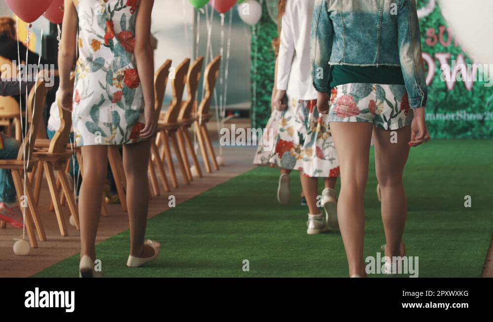 Teenage and preteen girls walking off podium at kids fashion show Stock ...