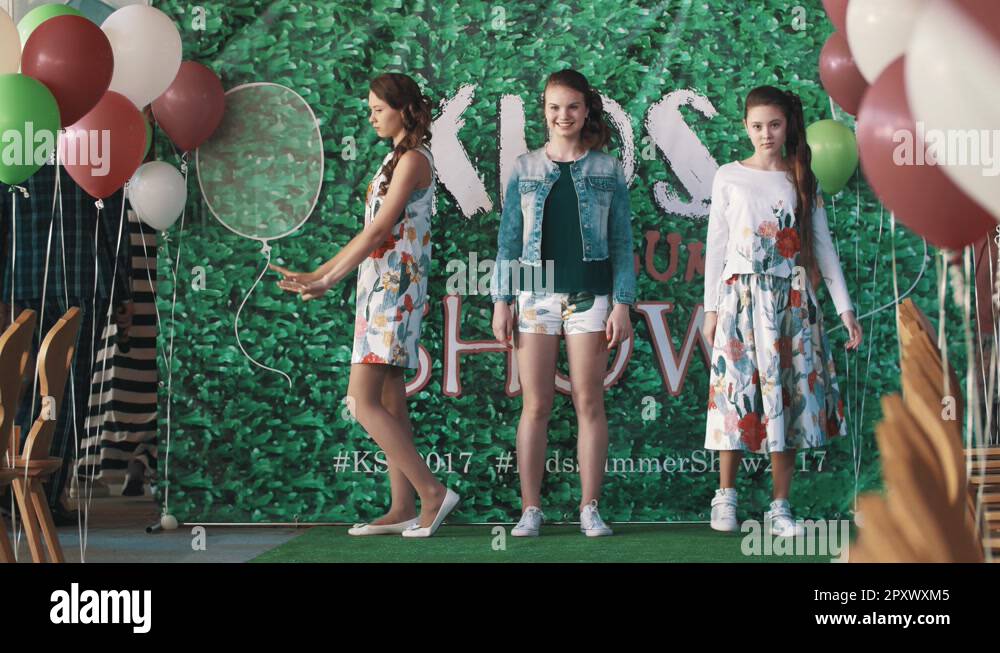 Teenage girls models hand movement on podium at kids fashion show Stock ...