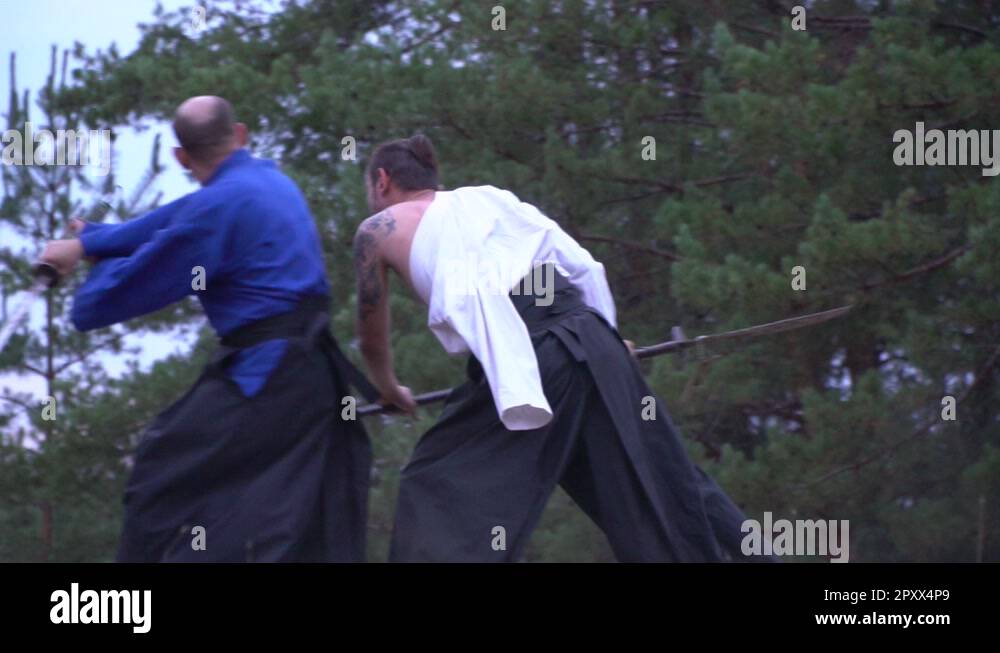 Samurai with a halberd skillfully fighting against a warrior with a ...