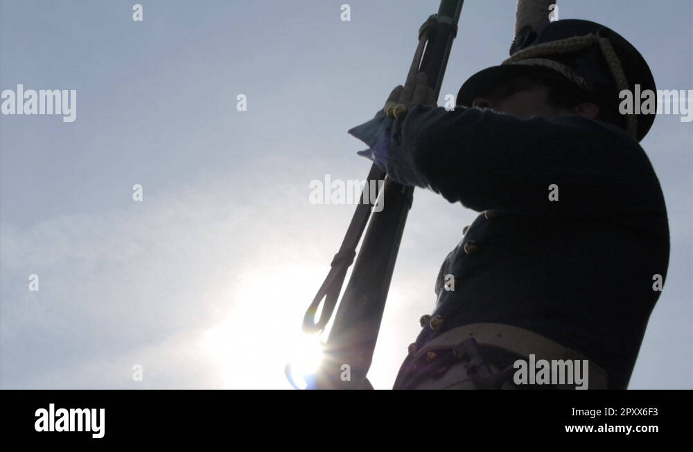 Military Cadet /Soldier in Shako and Coatee drills with musket ...