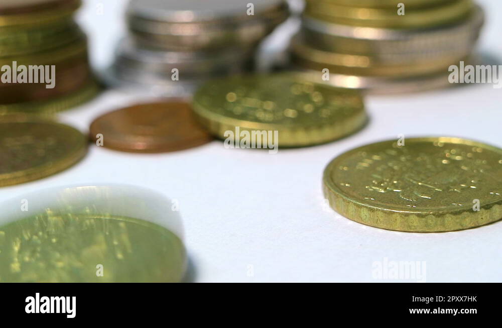 Unusual background from coins of different countries. The coin rotates ...