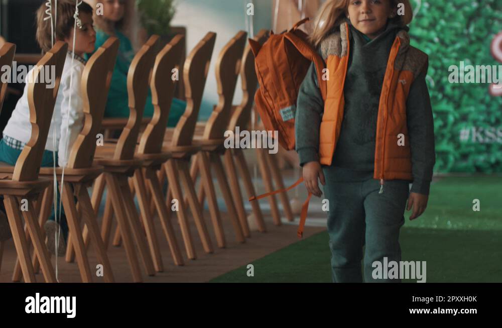 Little girl walking on catwalk showing winter clothes at kids fashion ...