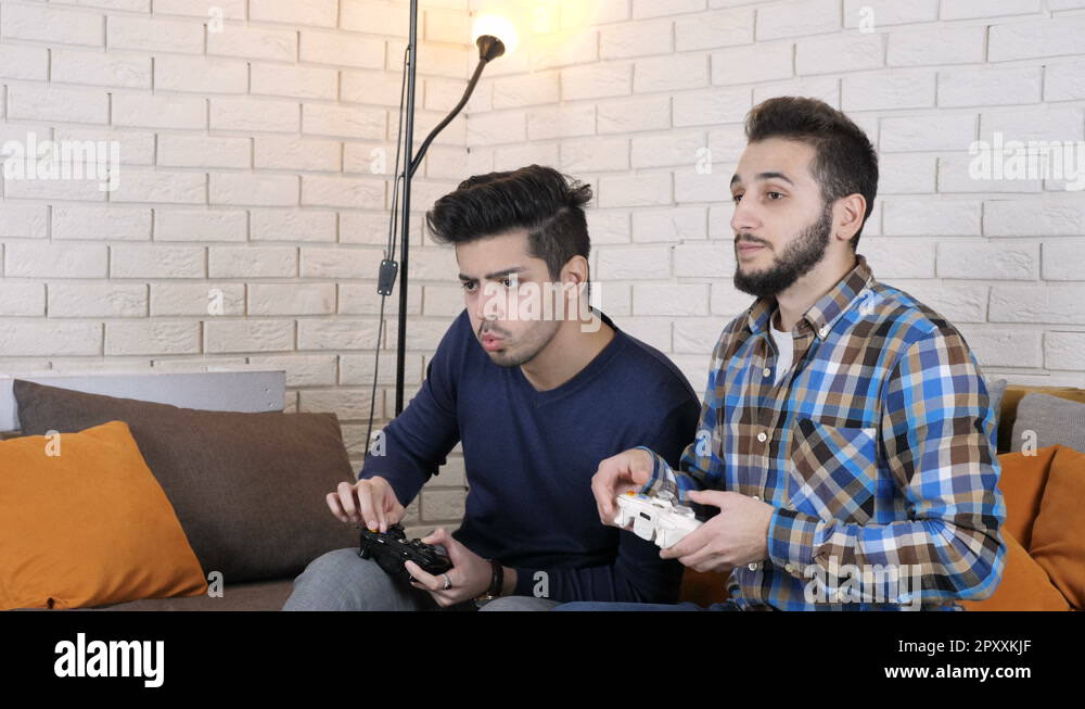 Two boys play a console game, one of them wins 50 fps Stock Video ...