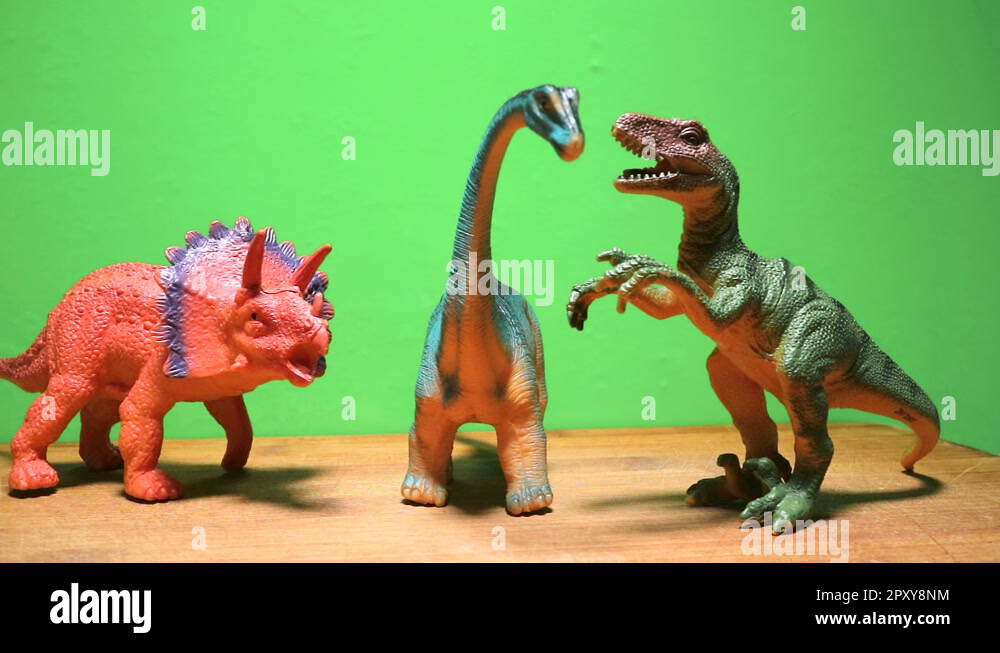 Dinosaurs Of The Jurassic Period Close Up On A Green Background Herbivores Stock Video Footage