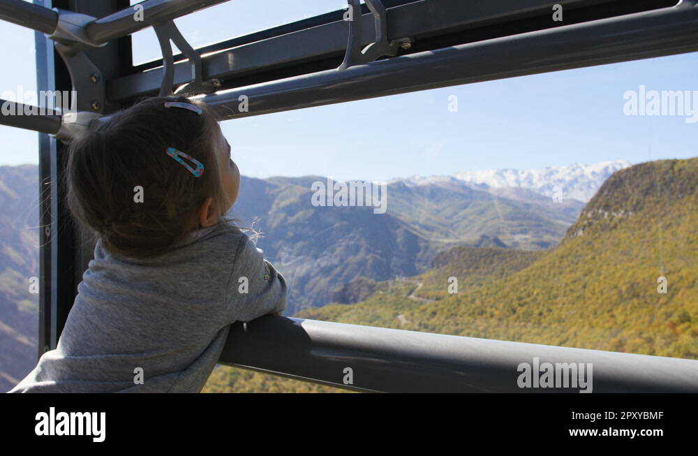 Little Tourist Girl Riding in Cable Car in the longest ropeway cabin ...