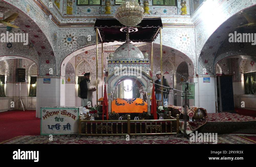 Sikh devotees fanning doing Chaur Sahib inside Gurdwara Panja Sahib ...