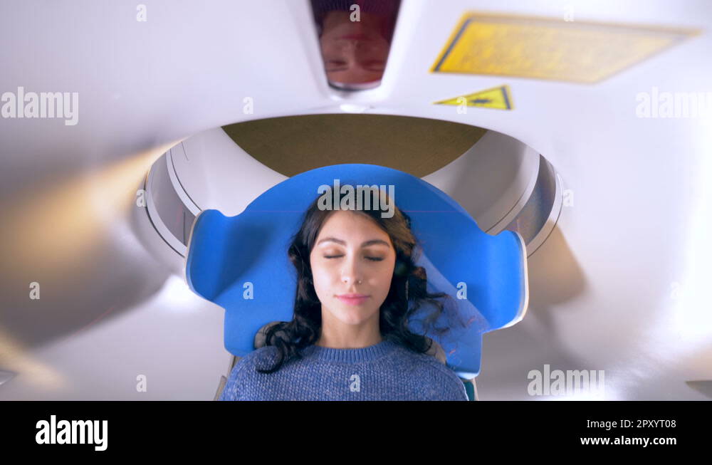 Hospital emergency MRI image scan. Woman lays in Magnetic Resonance ...