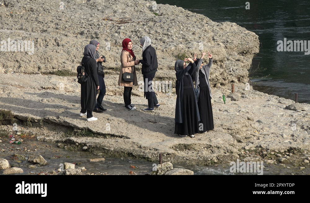 Veiled Muslim girls take photos at famous Mostar bridge in Bosnia ...