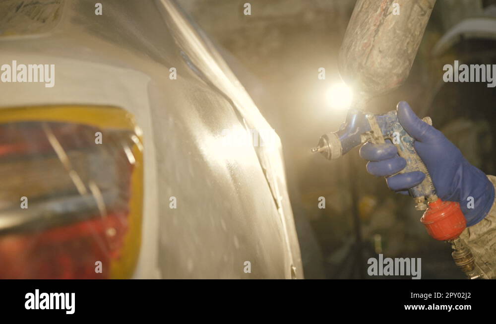 Mechanic spraying primer on a car surface. 4K Stock Video Footage - Alamy