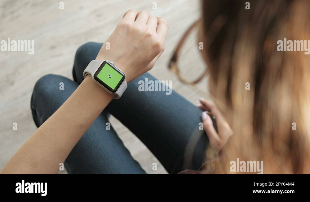Woman hands gestures on a modern smartwatch with a green screen Stock ...