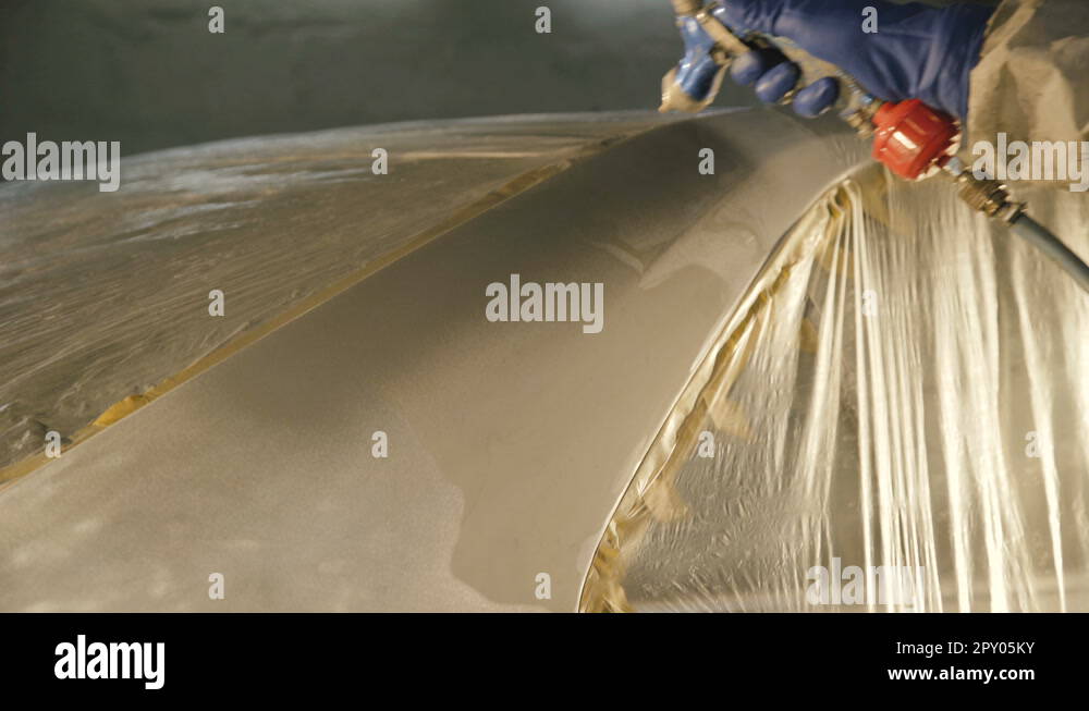 Mechanic spraying primer on a car surface. 4K Stock Video Footage - Alamy
