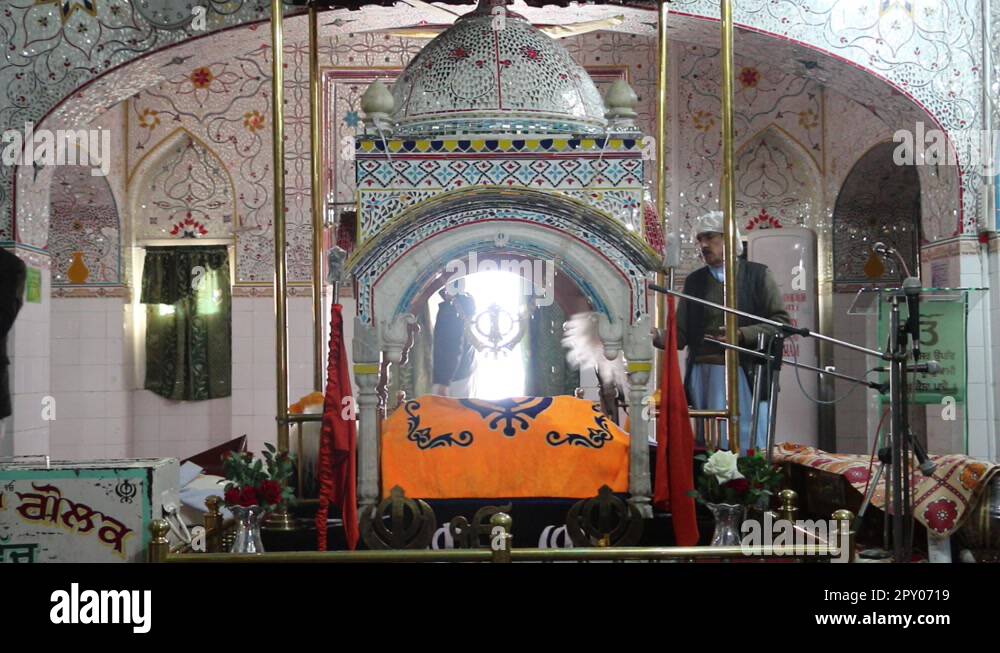 Sikh devotees fanning doing Chaur Sahib inside Gurdwara Panja Sahib ...