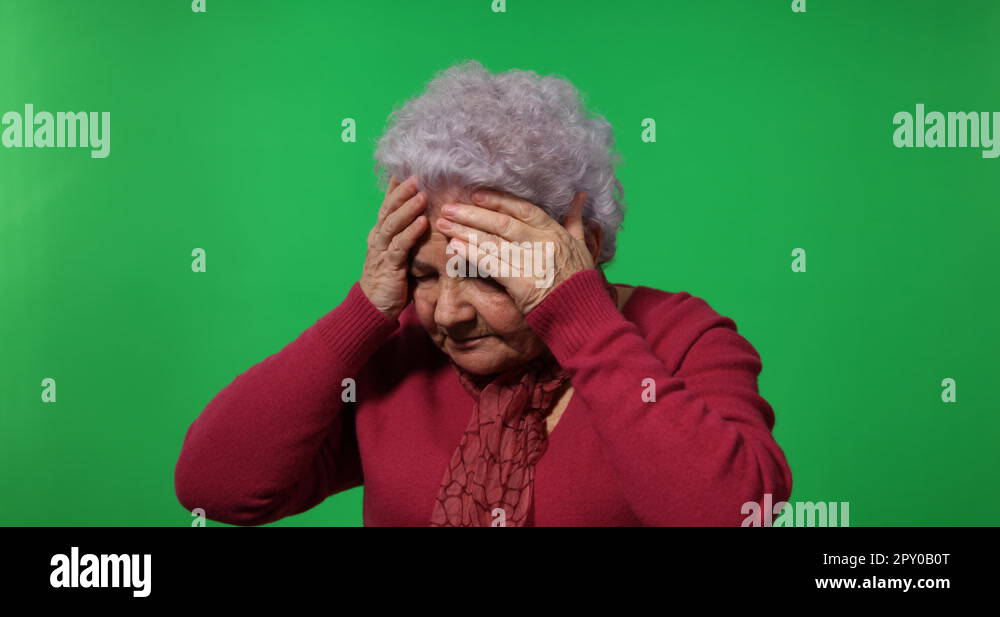 Unhappy Senior Business Woman Having a Sadness Moment on Green Screen ...