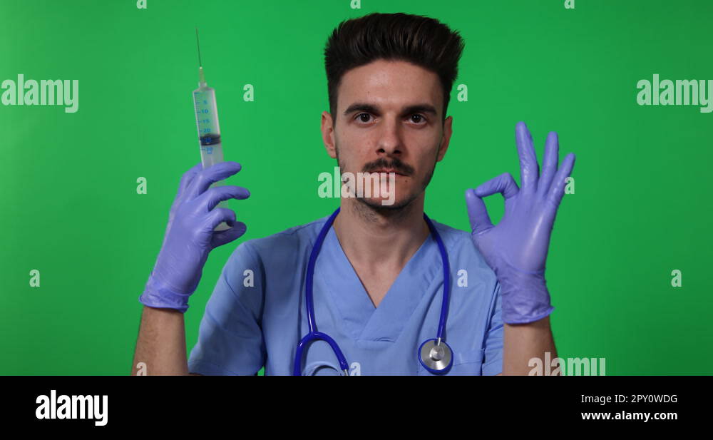 Medical Doctor Man Hold Syringe and Show Ok Sign Camera Green Screen ...
