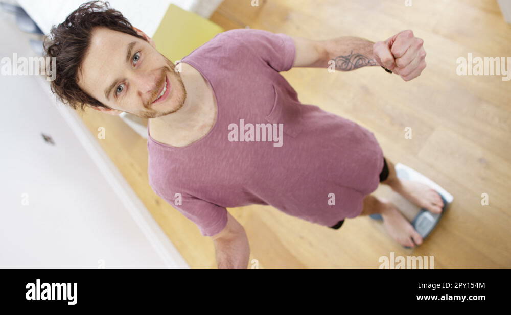 Man standing on scale Stock Videos & Footage - HD and 4K Video Clips ...