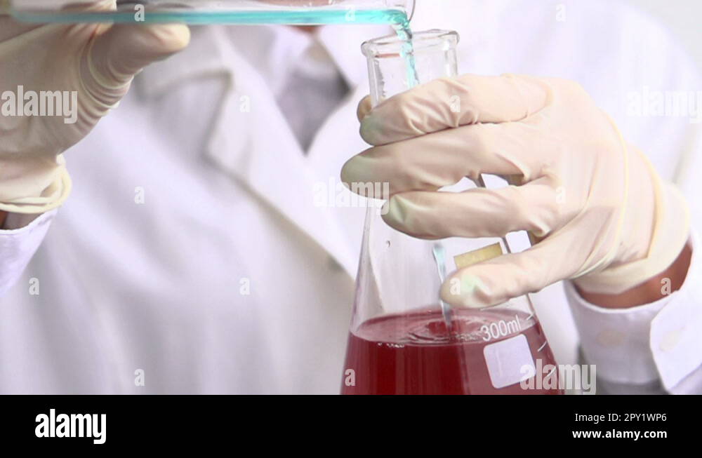 Scientist pouring liquid in erlenmeyer Stock Videos & Footage - HD and ...