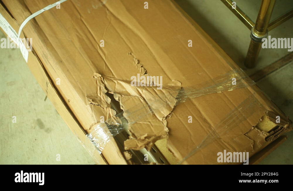 Broken shipment box Stock Videos & Footage - HD and 4K Video Clips - Alamy