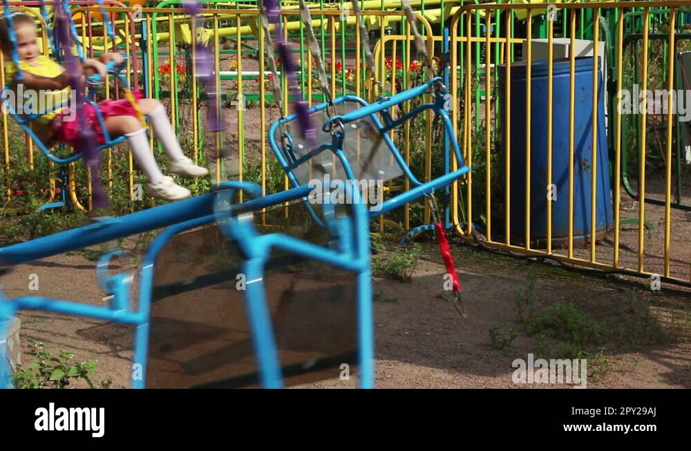 little girl riding on chained carousel Stock Video Footage - Alamy