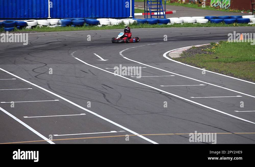 Go-kart in a curve front view Stock Video Footage - Alamy