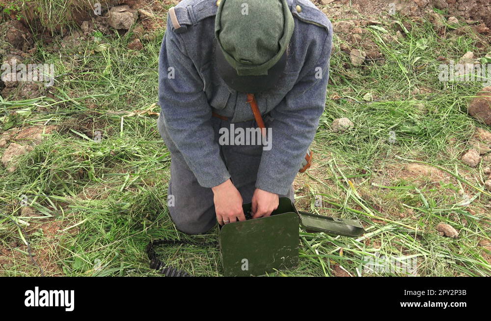 The soldier puts machine-gun tape in a drawer. The first world war.WWI ...