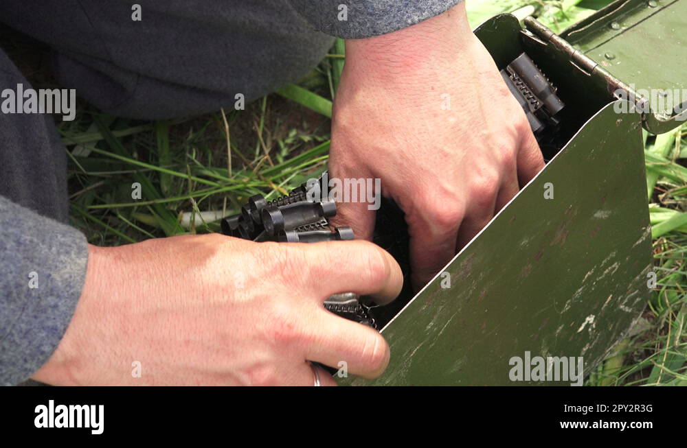 The soldier puts machine-gun tape in a drawer. The first world war.WWI ...