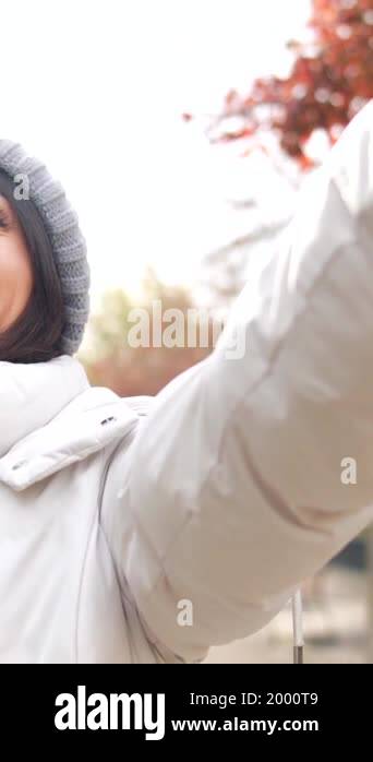 Cute caucasian woman taking selfie with mobile phone in the city in ...