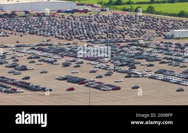 New cars parked on automotive factory parking lot for worldwide export ...