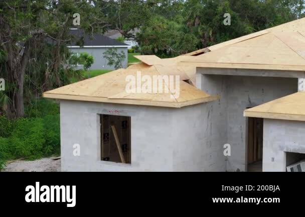 Roof construction from plywood sheets at new house building site ...