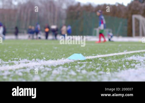 winter soccer field kids training in bok Soccer practice occurs on a ...