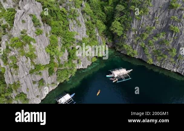 Breathtaking aerial view of dramatic limestone cliffs, lush greenery ...