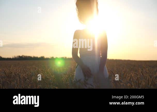 Carefree woman rising head and waving her hair in air with beautiful ...
