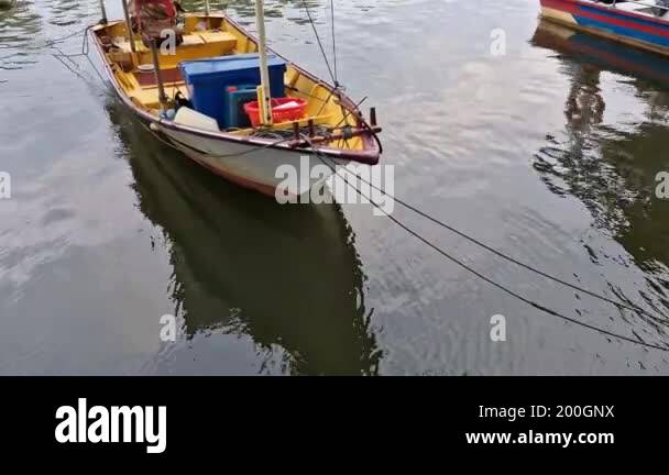 Static shot of simple traditional boat made from wooden and fiberglass ...