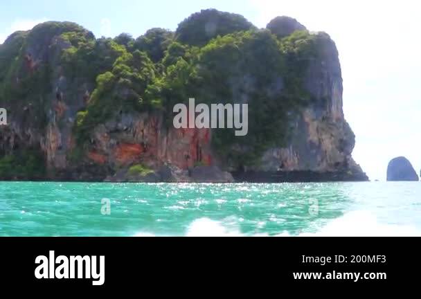 Swimming past limestone rocks cliffs and turquoise waters with long ...