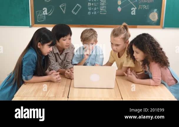 Top view diverse student looking at laptop and learning about coding engineering code and ...