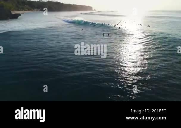 Surfers on surfboard riding on perfect barrel wave. Surfing on perfect ...