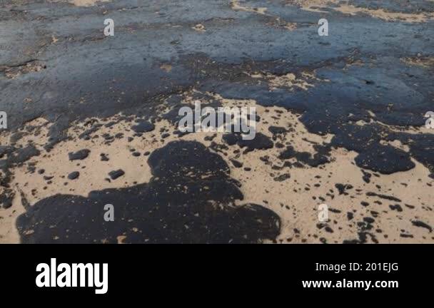 Oil in ocean coastline after a tanker wreck. Oil fuel polluted and ...