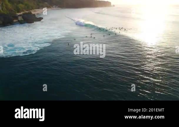 Surfers on surfboard riding on perfect barrel wave. Surfing on perfect ...