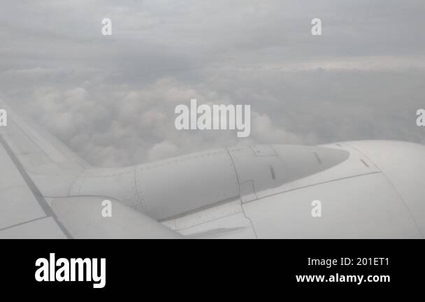 Scenic Aerial View from Airplane Window over Soft Clouds on Overcast ...