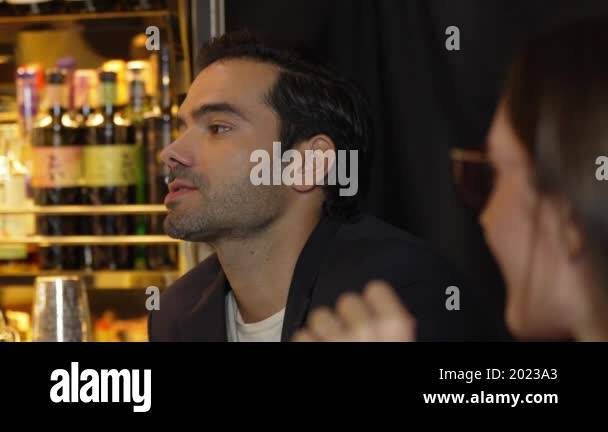 Smiling smart VIP customer talking lively conversation with friend or ...