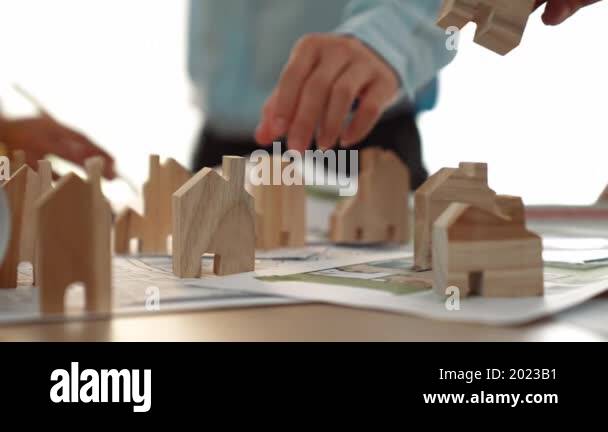 Architect and engineer discuss about building blueprint on table with ...