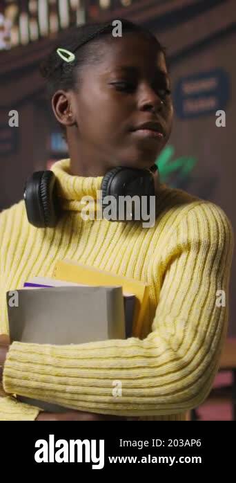 Vertical Video Portrait of african american scholar arriving at the ...