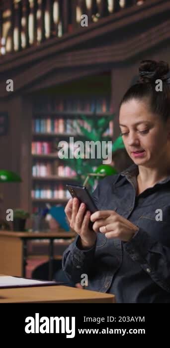 Vertical Video Noisy person disturbing people at the library by ...