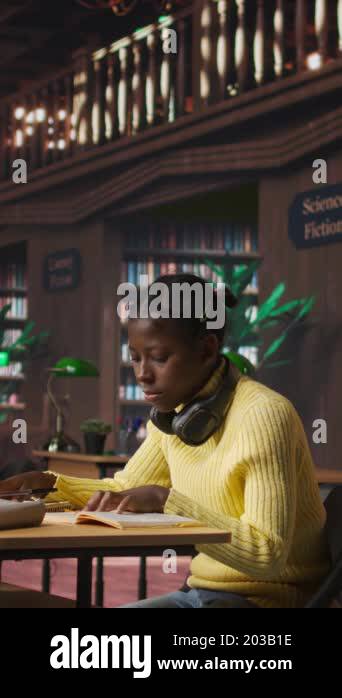 Vertical Video Portrait of cute teenager carrying textbooks and study ...