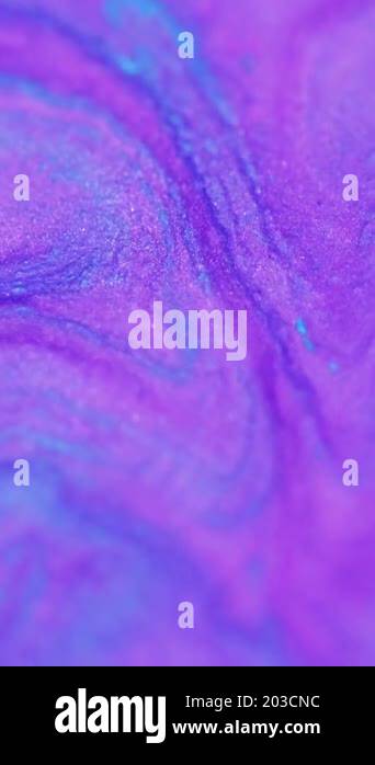 Vertical video. Glitter paint flow. Shimmering fluid. Defocused neon ...