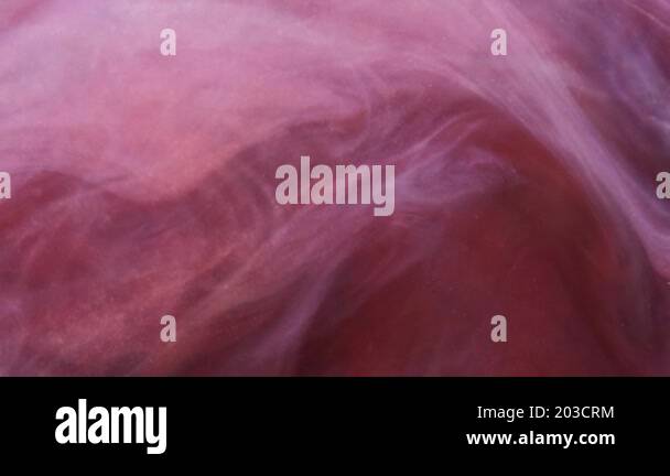 Ink water drop. Shimmering wave. Defocused bright pink red cloud ink ...