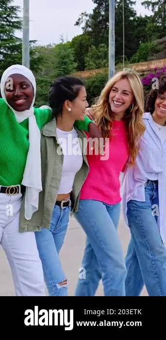 Vertical HD video of diverse group of young women friends walking ...