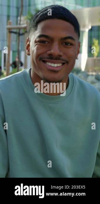 Vertical HD video portrait of cheerful black student smiling at camera ...