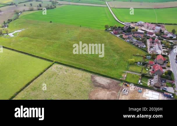 Aerial footage across the beautiful small town of Little Ribston in the ...