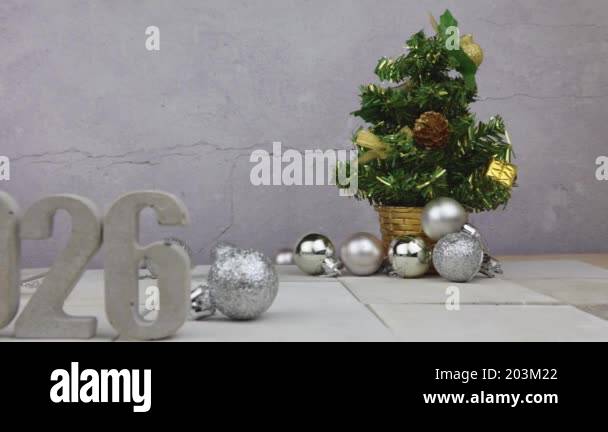 A Christmas Tree with golden and silver decorations, revealing number ...
