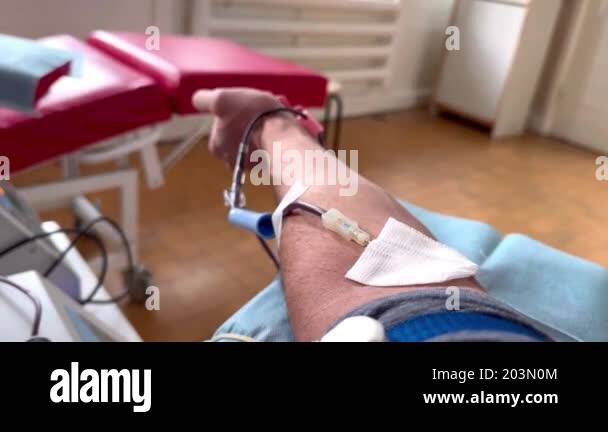 Extraction of blood from a vein using a needle Stock Video Footage - Alamy